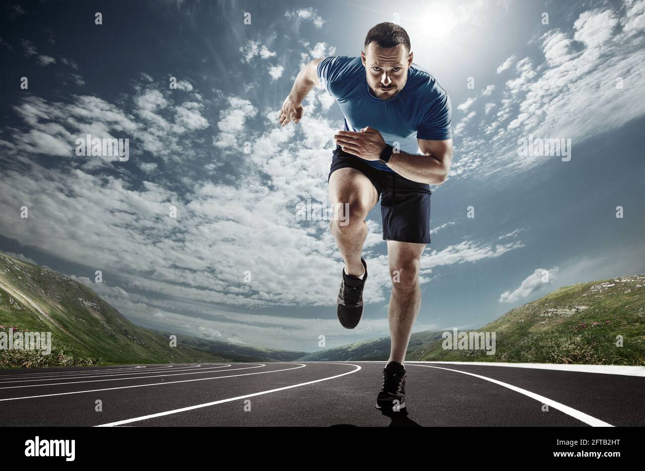 Professional male runner, jogger on road and sky background. Caucasian ...