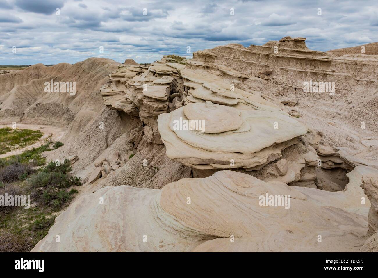 Sandstone formations atop solfter clay in Toadstool Geologic Park ...