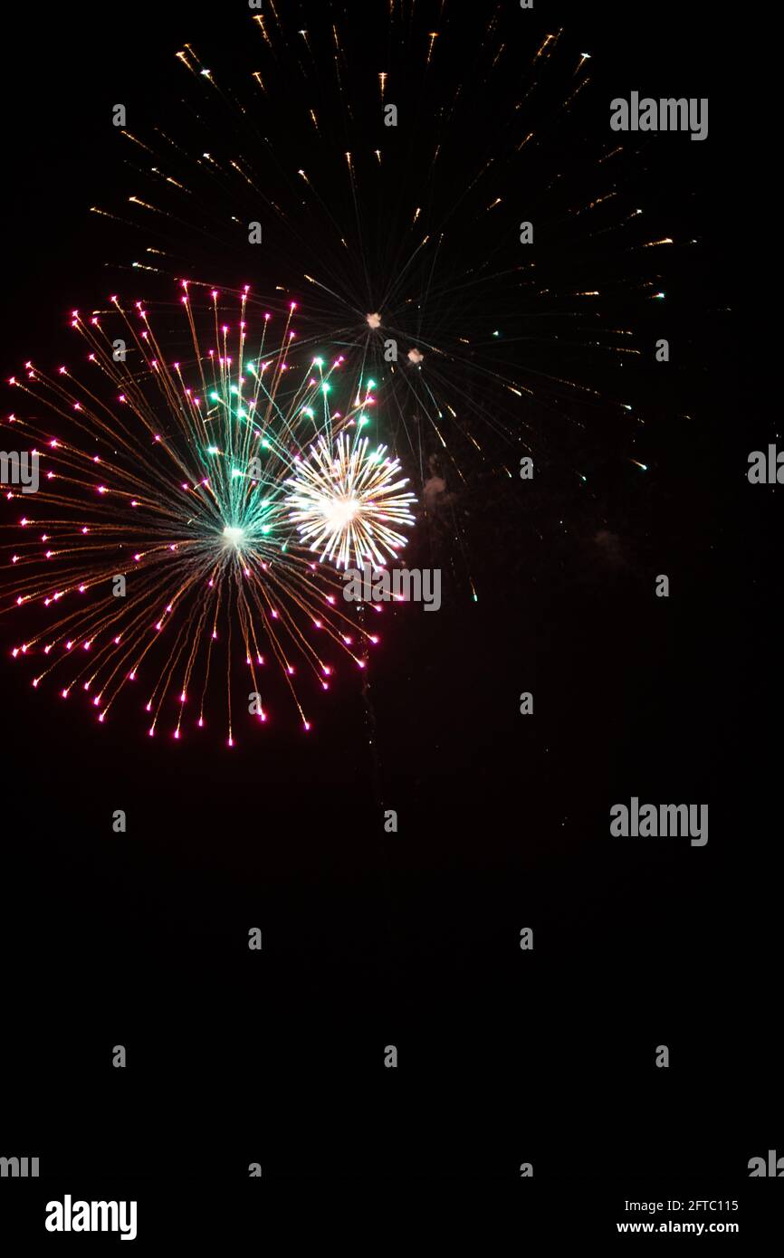 Vertical shot of firework at night Stock Photo - Alamy