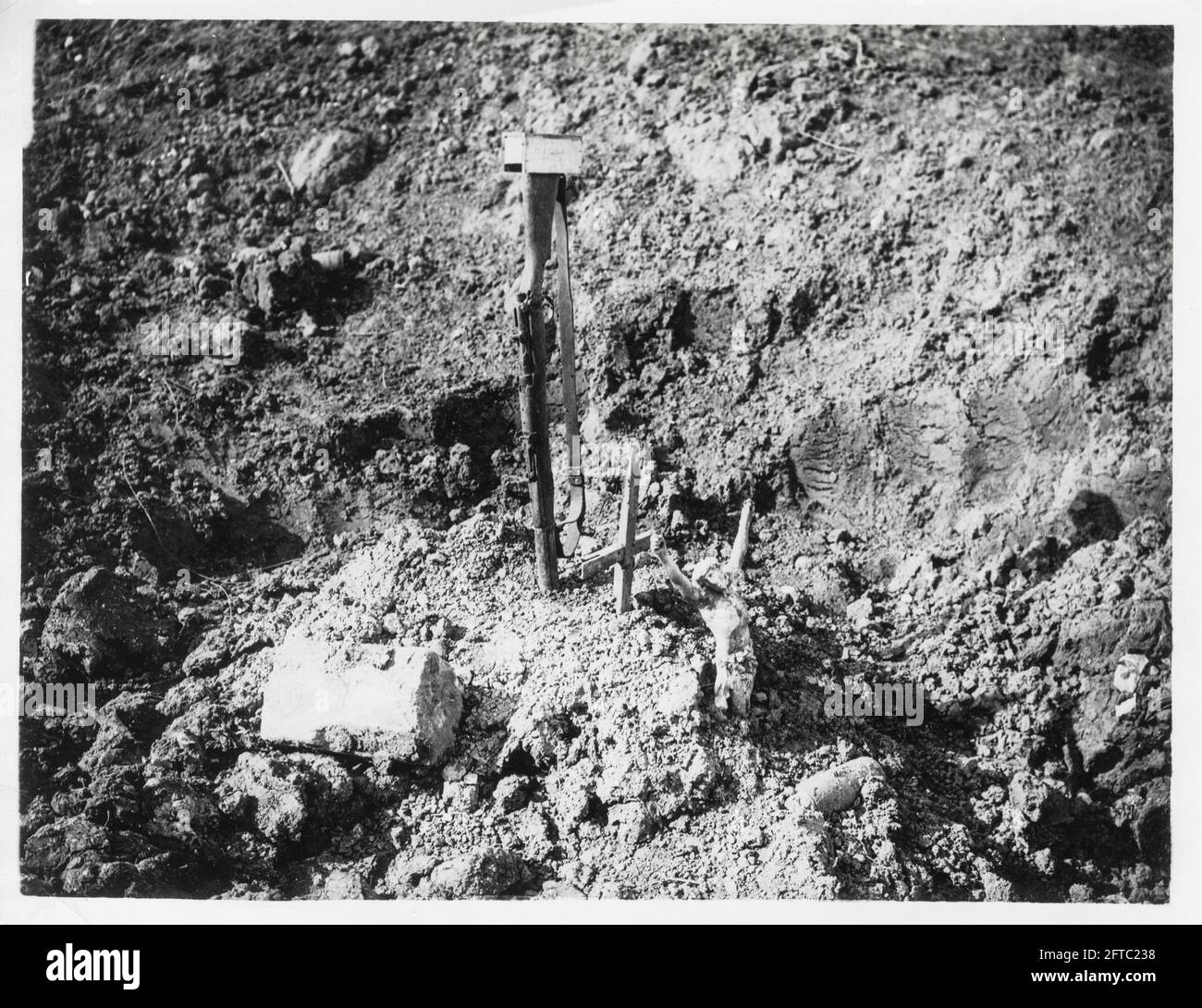 World War One, WWI, Western Front - A grave in a shell hole with rifle ...