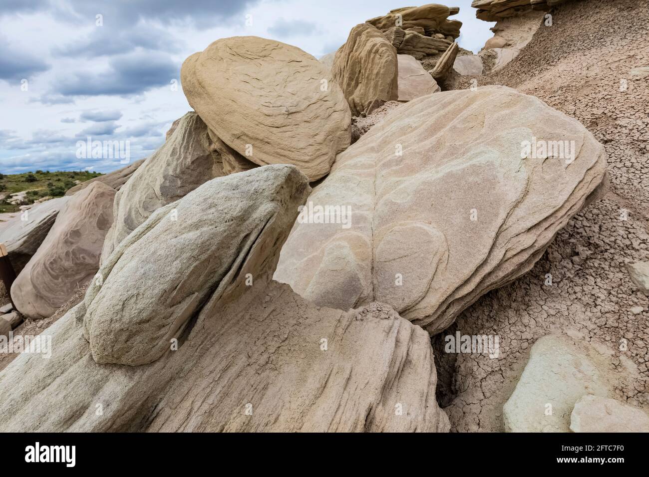 Sandstone formations atop solfter clay in Toadstool Geologic Park ...