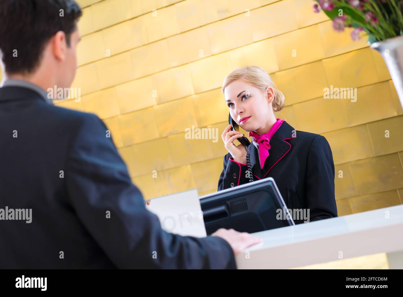 Hotel receptionist working computer hi-res stock photography and images ...
