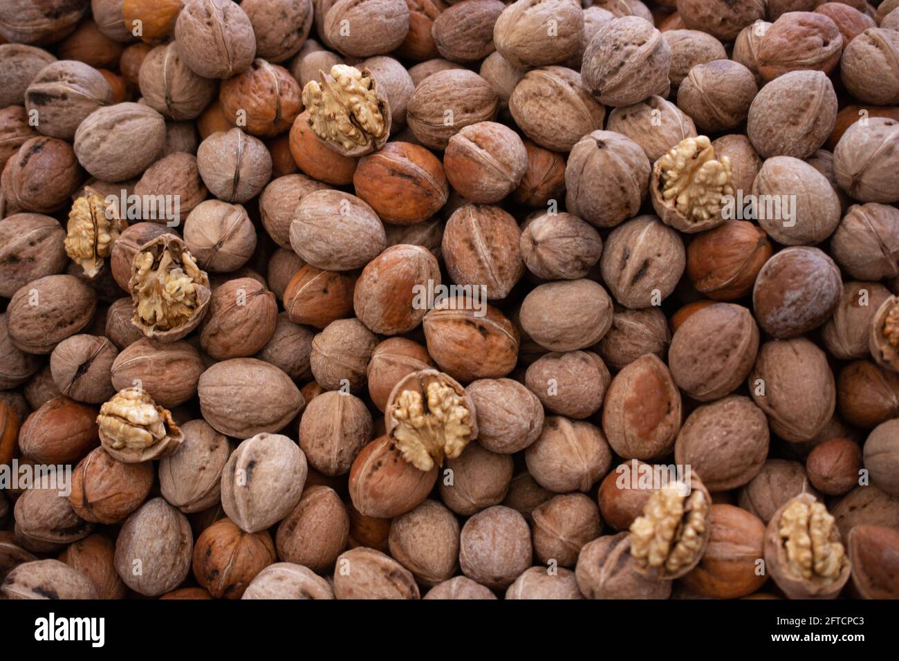 Whole walnuts background. Healthy organic food concept Stock Photo - Alamy