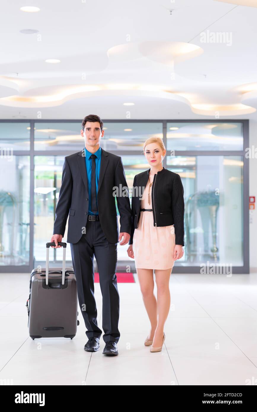 Woman arriving at hotel lobby hi-res stock photography and images - Alamy
