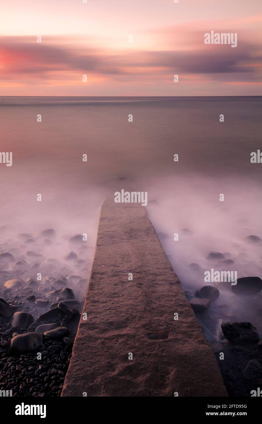 Stone jetty leading into the sea, Madeira Stock Photo - Alamy