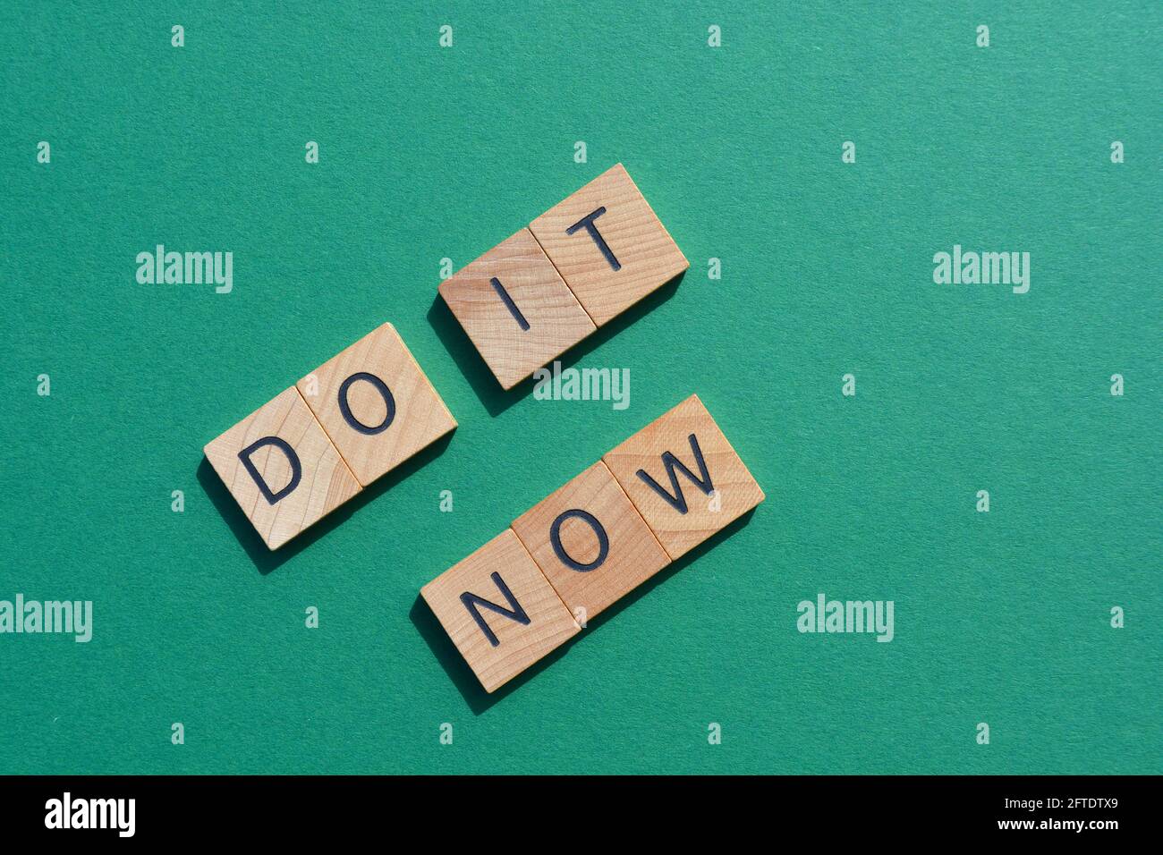 Do It Now, motivational words in wooden alphabet letters isolated on ...