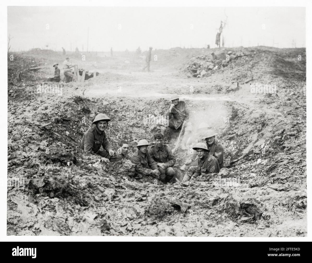 World War One, WWI, Western Front - Men taking shelter in a shell hole ...