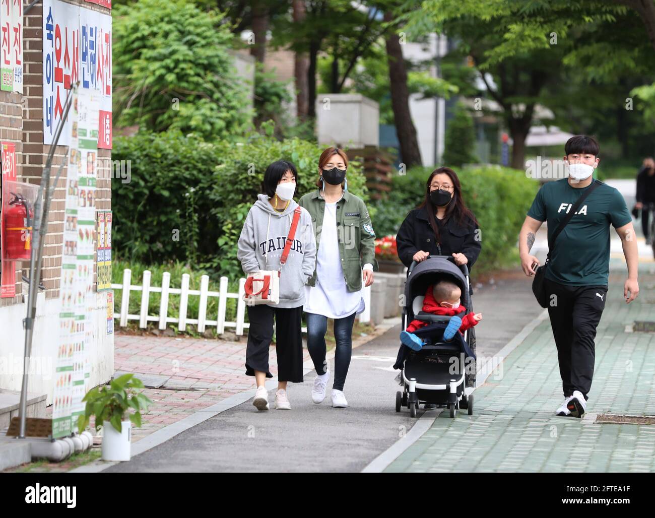 Seoul, South Korea. 21st May, 2021. People wearing face masks walk on a ...