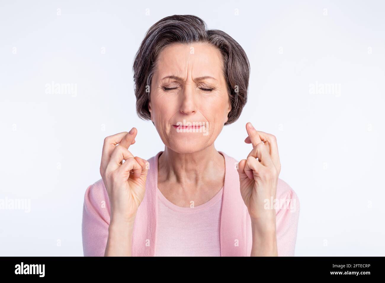 Photo of aged woman crossed fingers worried beg pray wish hope wish ...