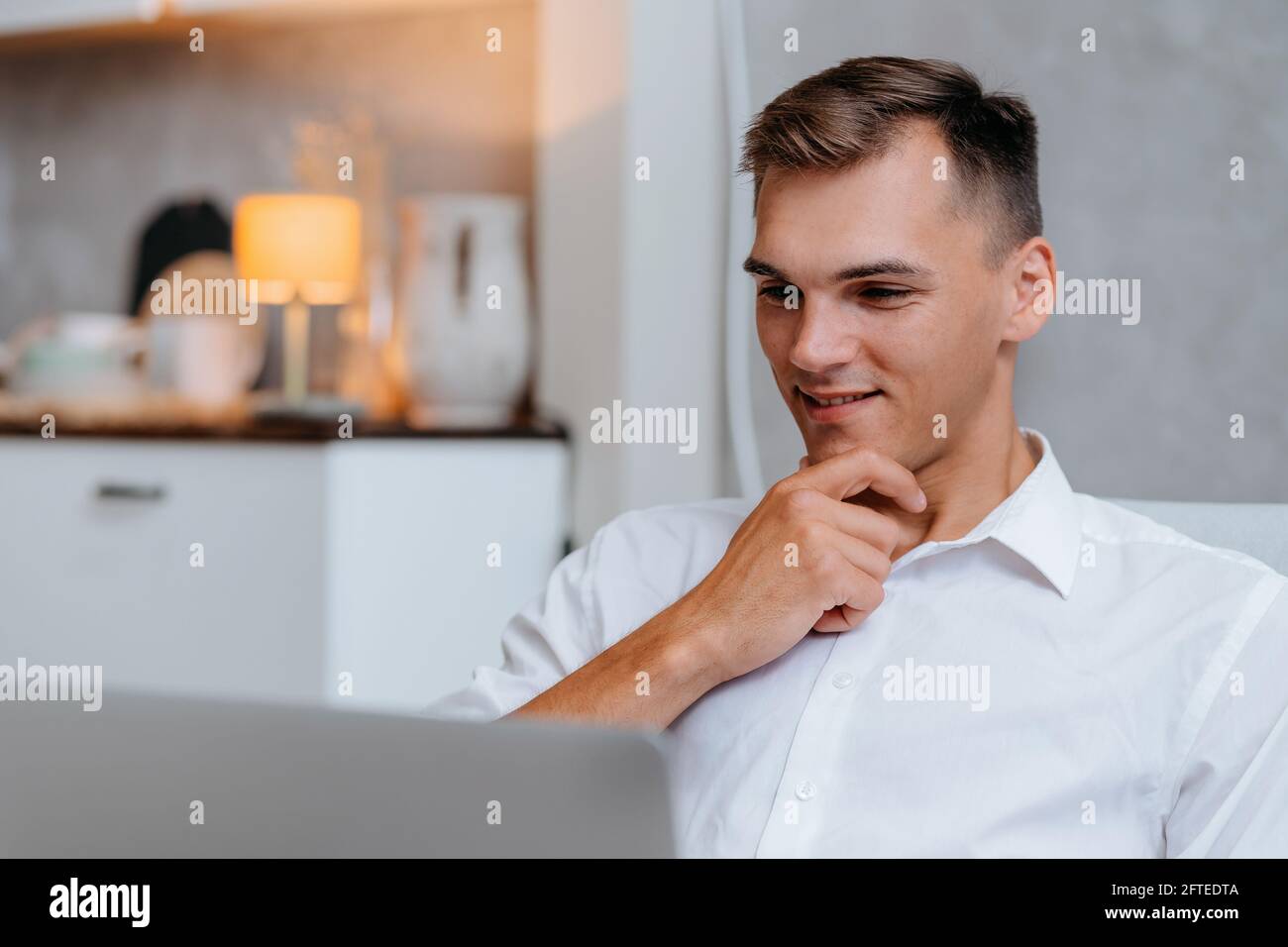 Man illuminated by laptop sofa hi-res stock photography and images - Alamy