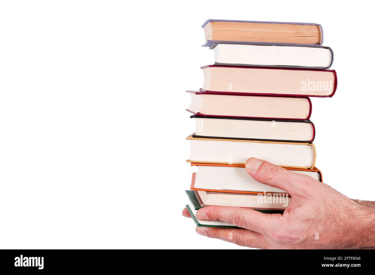 hands holding stacked books on white background Stock Photo - Alamy