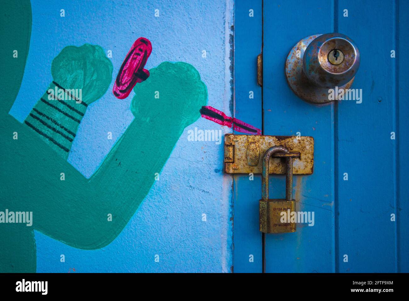Thief breaks open a lock , art in thailand Stock Photo - Alamy