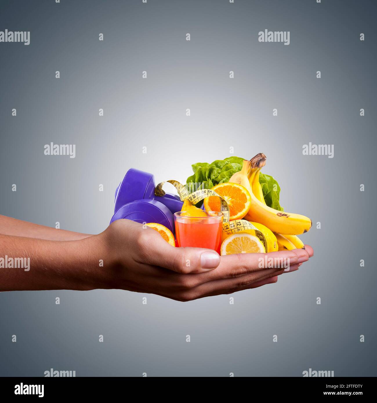 hands with healthy, natural foods, juice and weights for exercise Stock ...