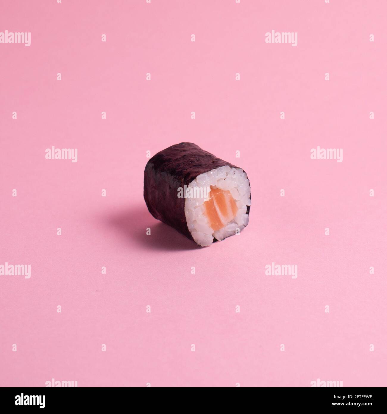 Close up sushi roll on pink background Stock Photo - Alamy