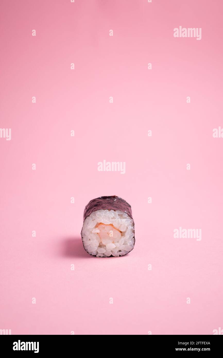 Prawn sushi roll on pink background Stock Photo - Alamy