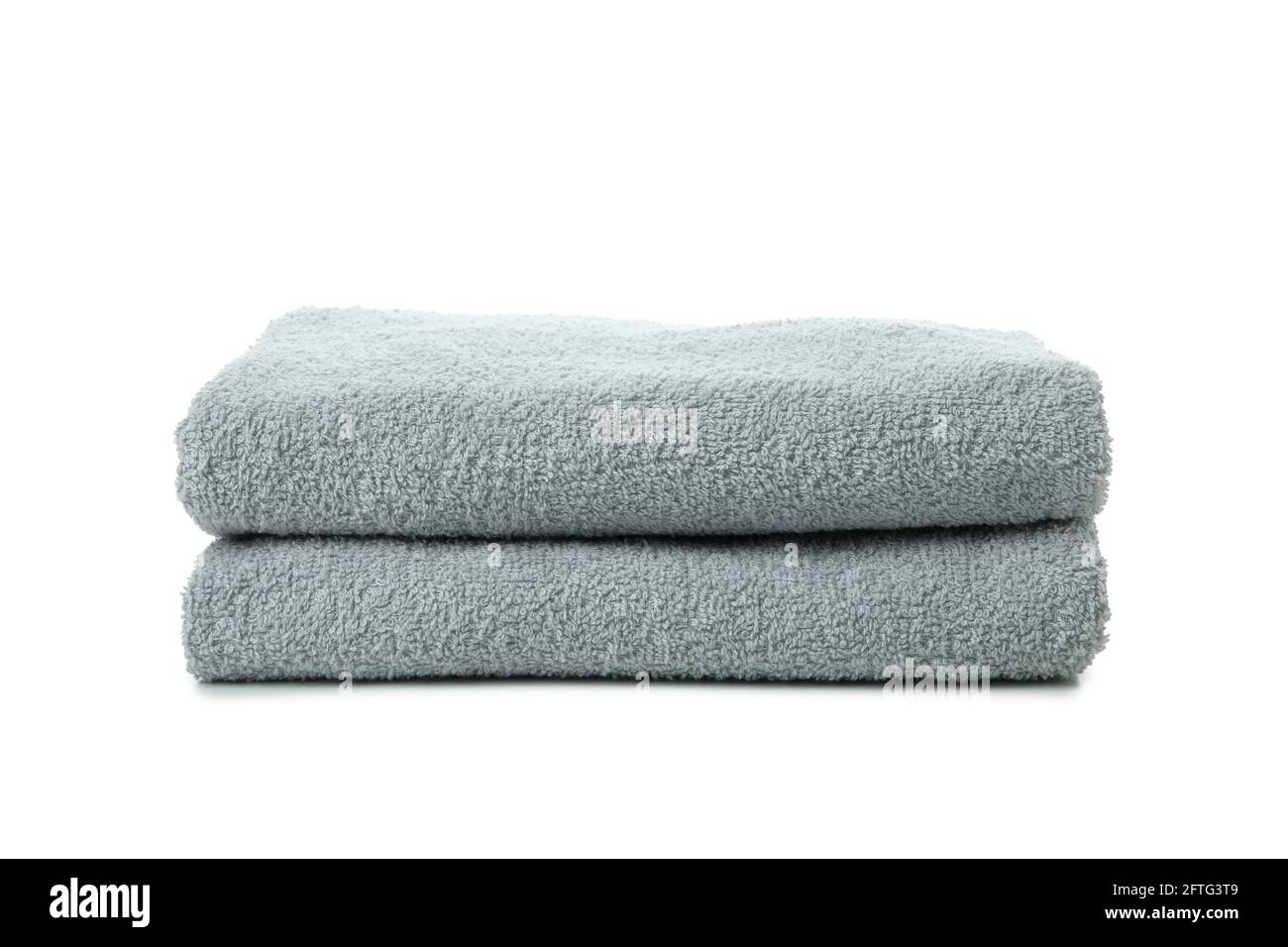 Folded clean towels isolated on white background Stock Photo - Alamy