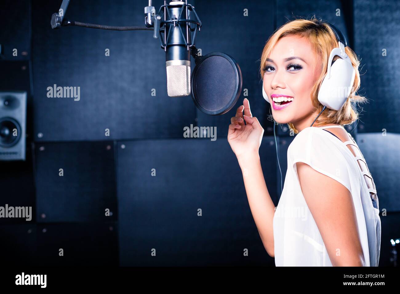 Female musician recording song hi-res stock photography and images - Alamy