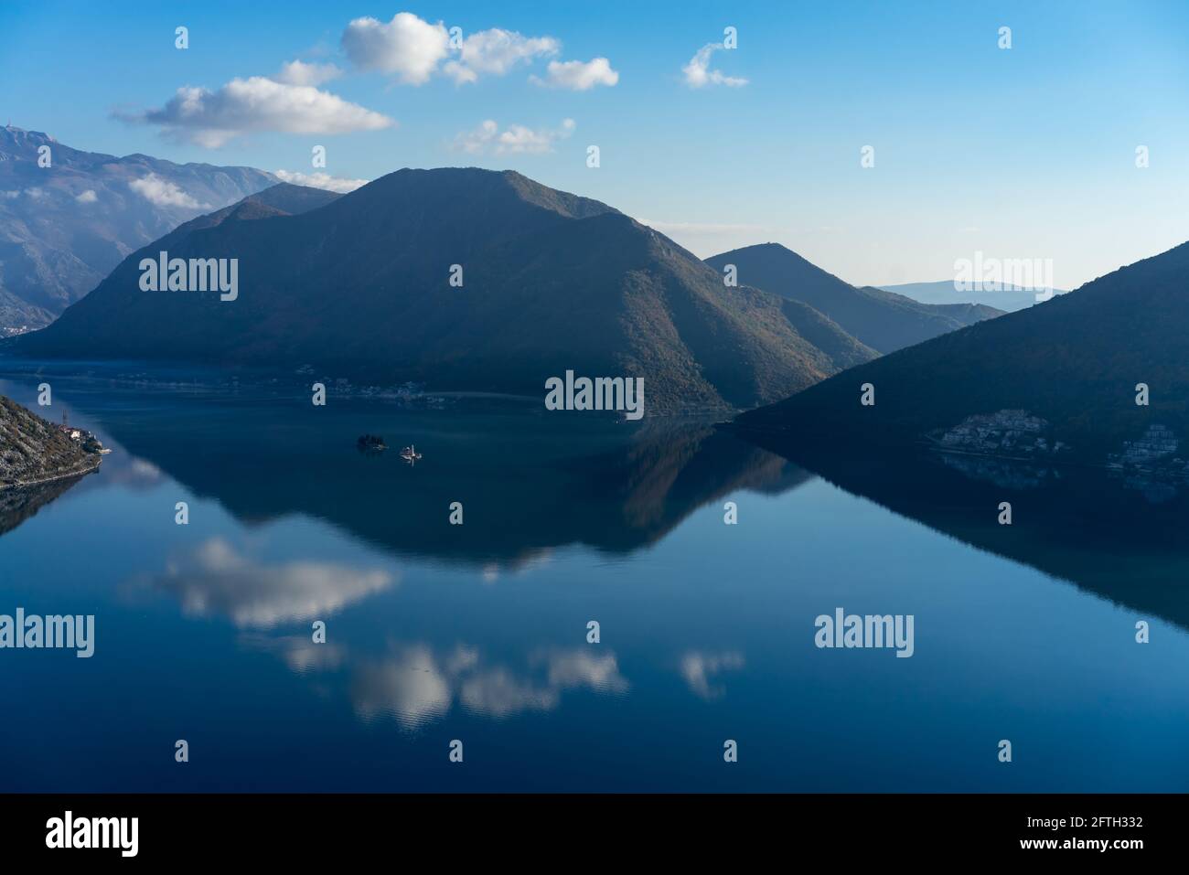 Old town Perast in the Kotor Bay, church and two islands with St ...