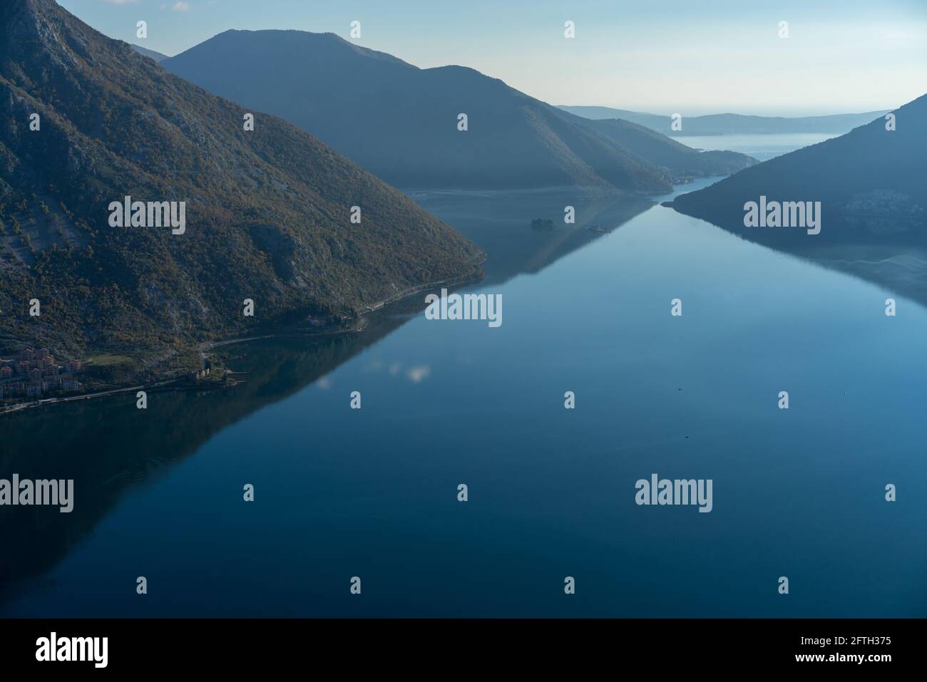 Old town Perast in the Kotor Bay, church and two islands with St ...