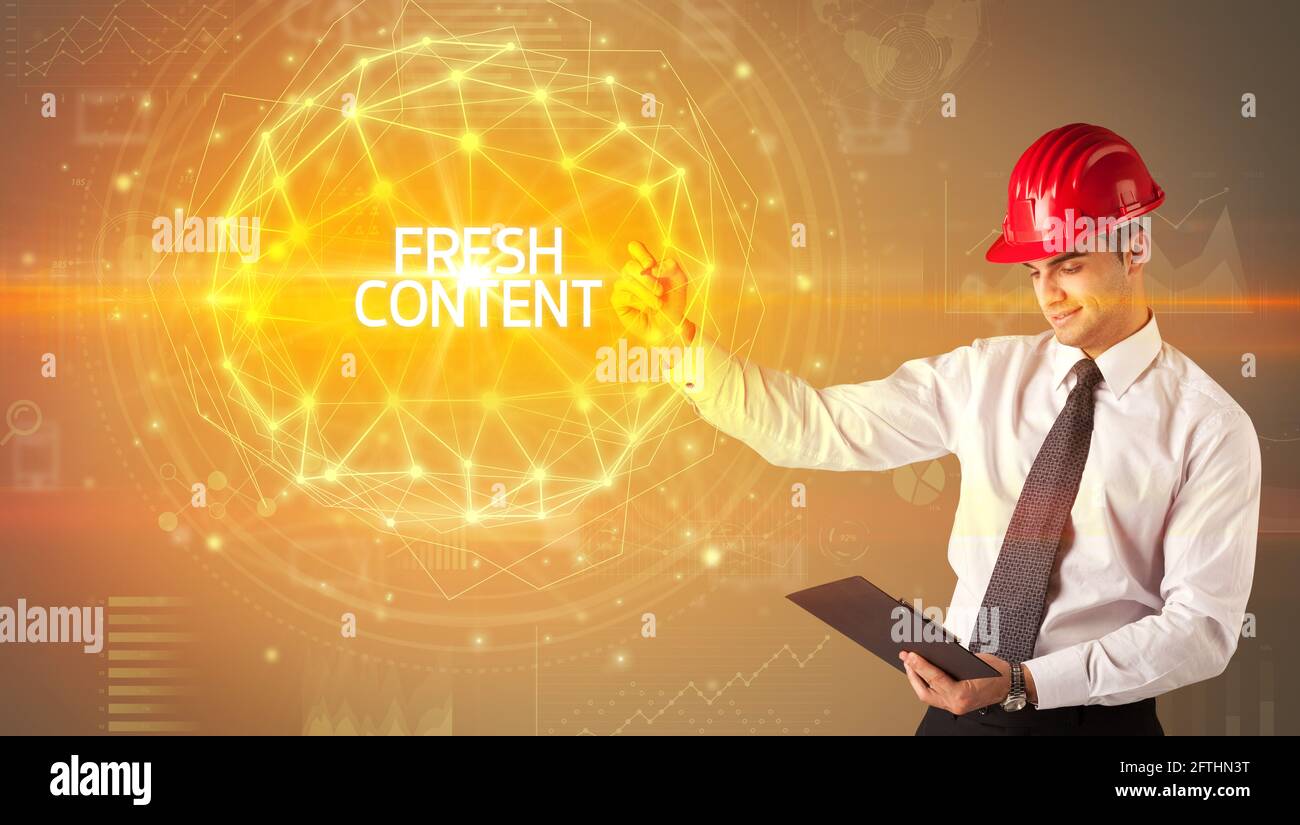 Handsome businessman with helmet drawing Stock Photo - Alamy