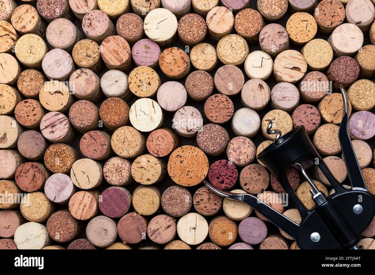Collection of used wine corks with corkscrew top view Stock Photo - Alamy