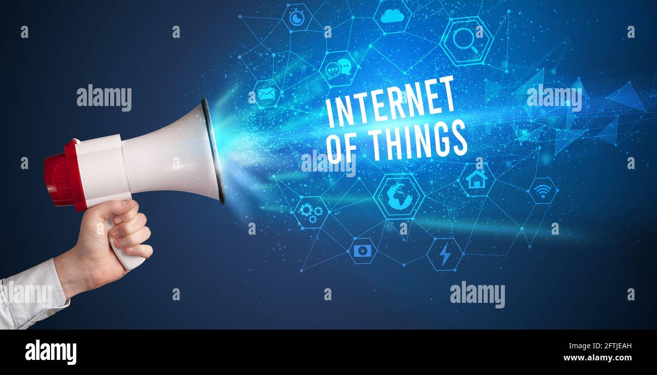 Young woman shouting in megaphone, technology announcement concept ...