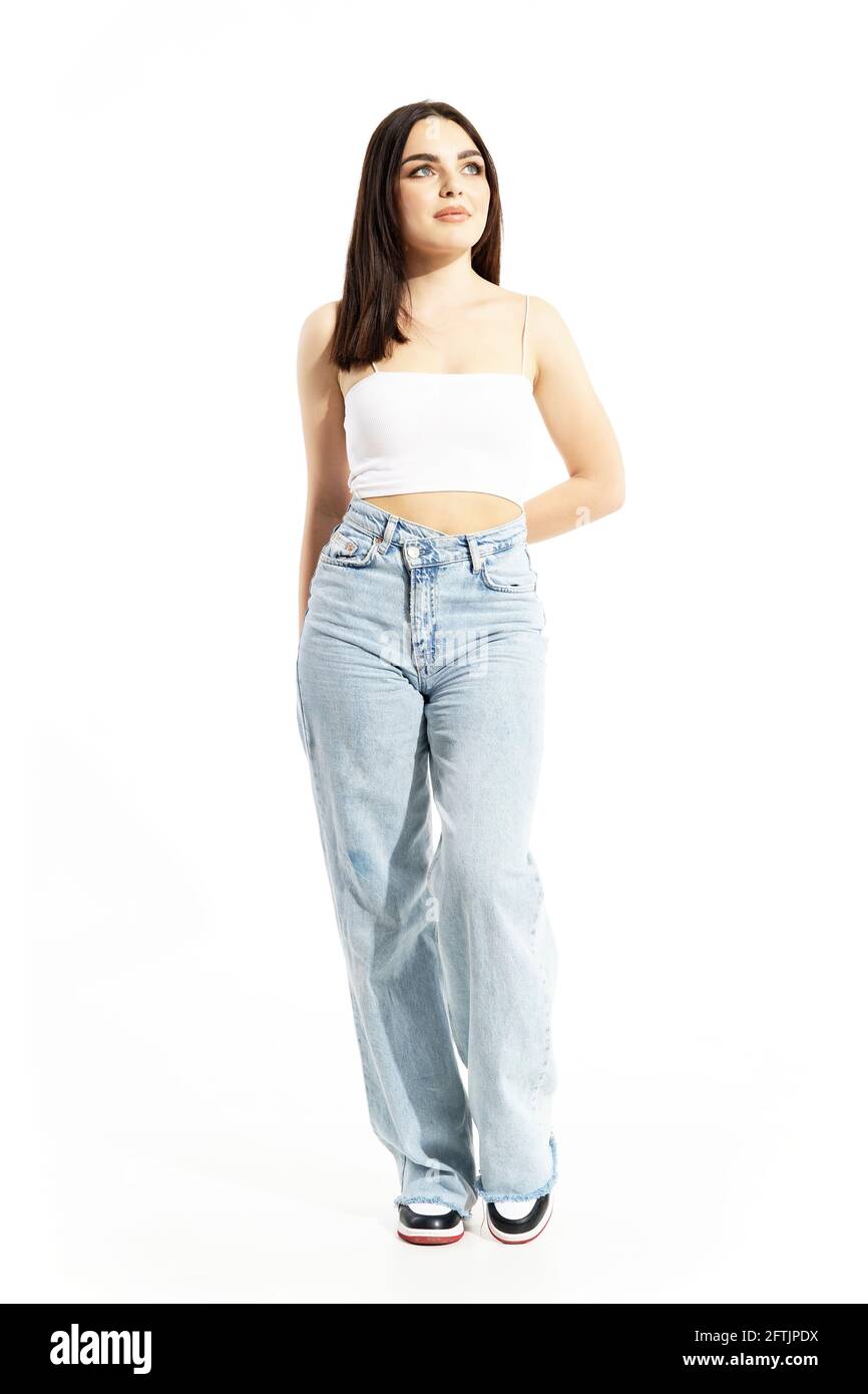 Calm summer street style girl standing and looking up. Full body length ...