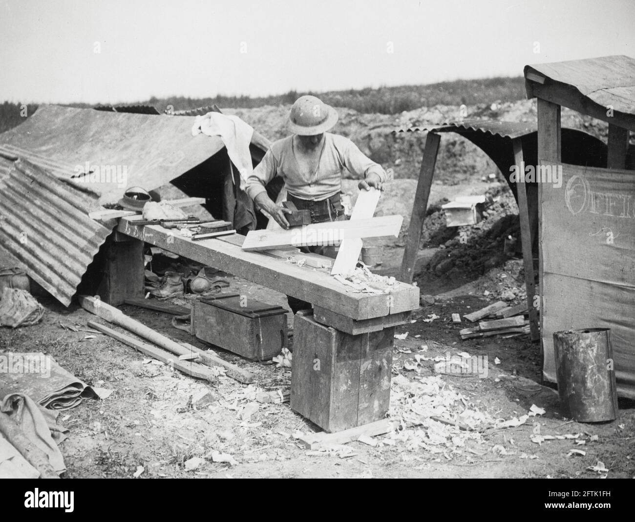 World War One, WWI, Western Front - Soldier making a wooden cross to ...