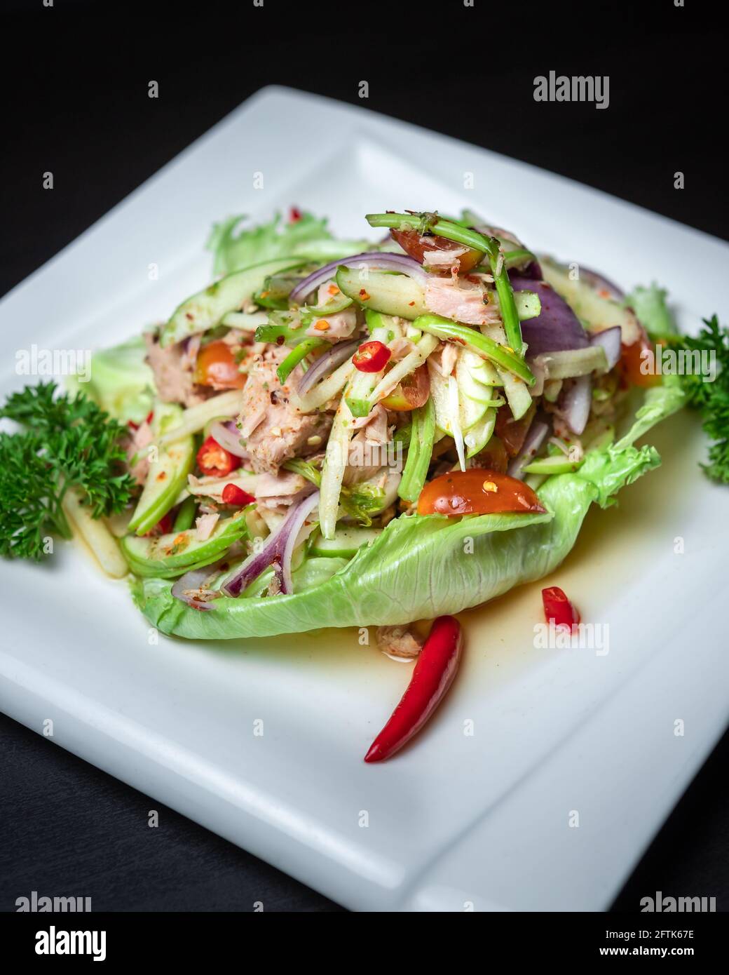 A Dish of Thai Spicy Tuna Salad with Green Mango Stock Photo - Alamy