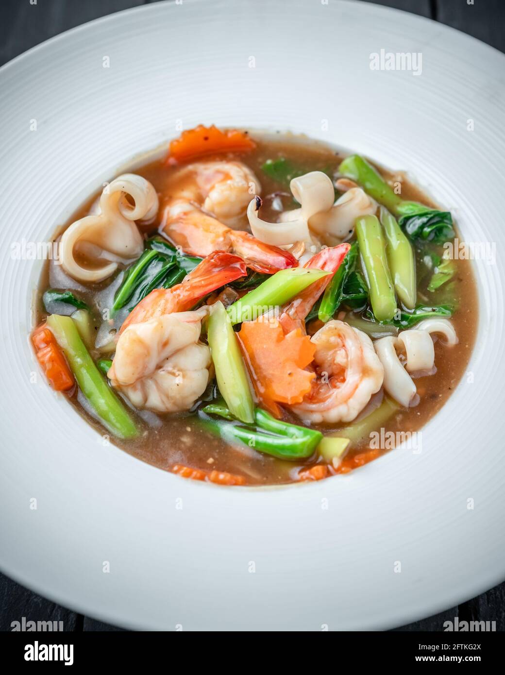 A Dish of Thai Rat Na Noodle with Seafood, Chinese Broccoli, and ...