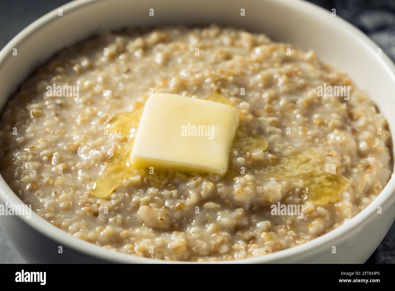 Homemade Creamy Scottish Oatmeal with a Pad of Butter Stock Photo - Alamy