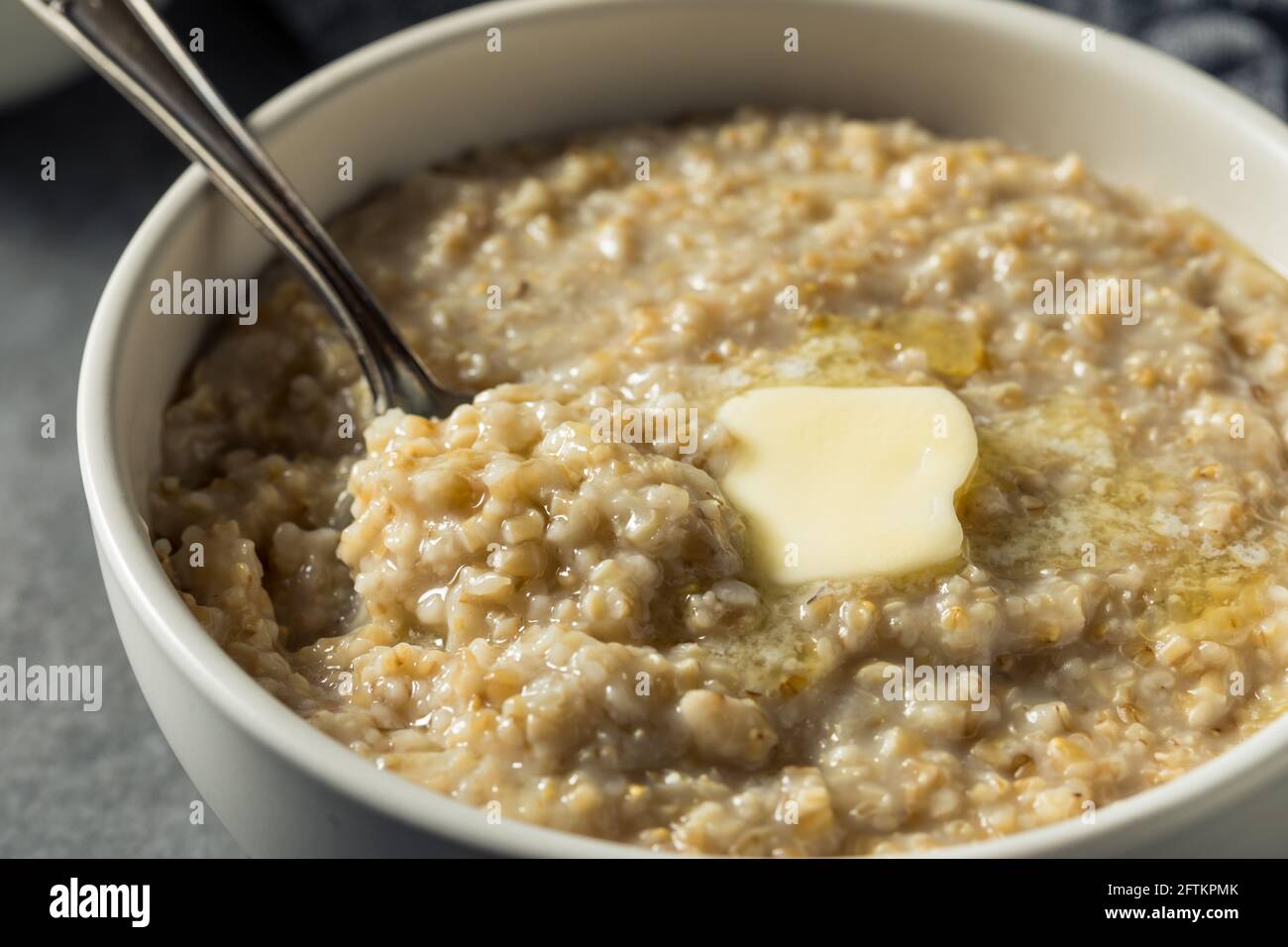 Homemade Creamy Scottish Oatmeal with a Pad of Butter Stock Photo - Alamy