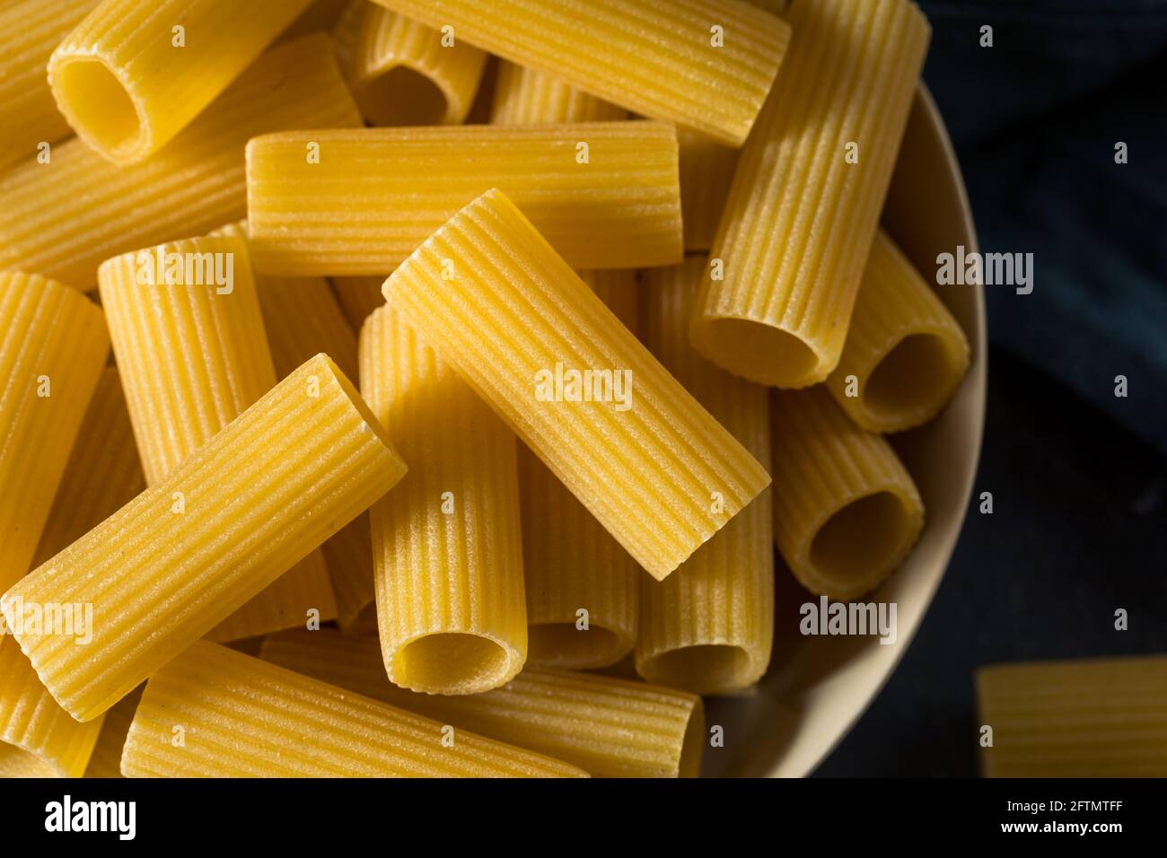 Organic Dry Rigatoni Pasta in a Bowl Stock Photo - Alamy