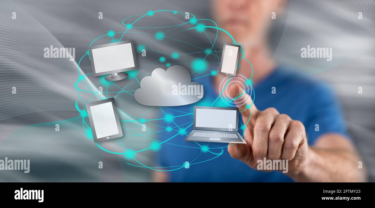 Man touching a cloud computing concept on a touch screen with his ...