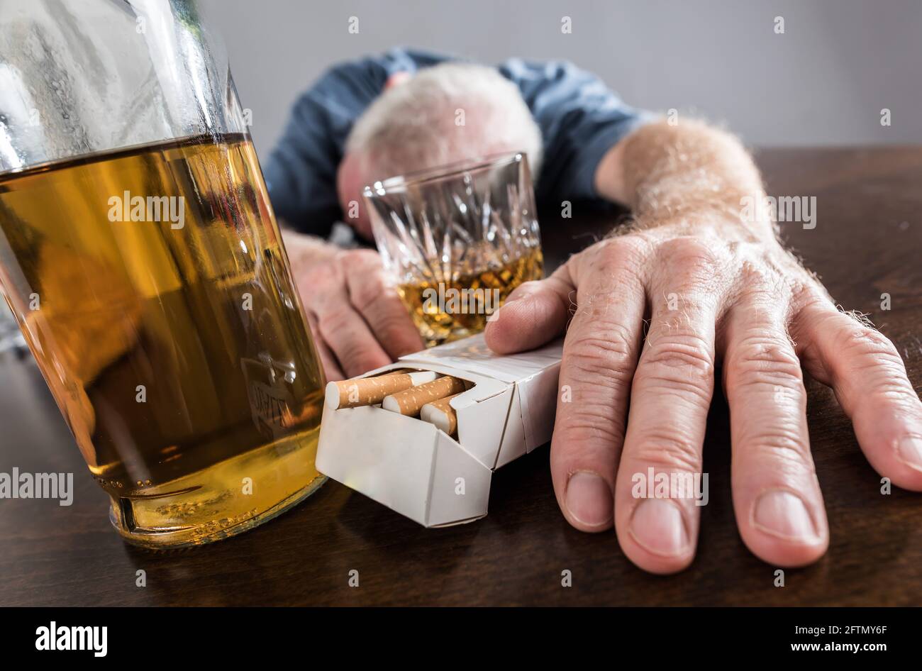 Slumped at table hi-res stock photography and images - Alamy