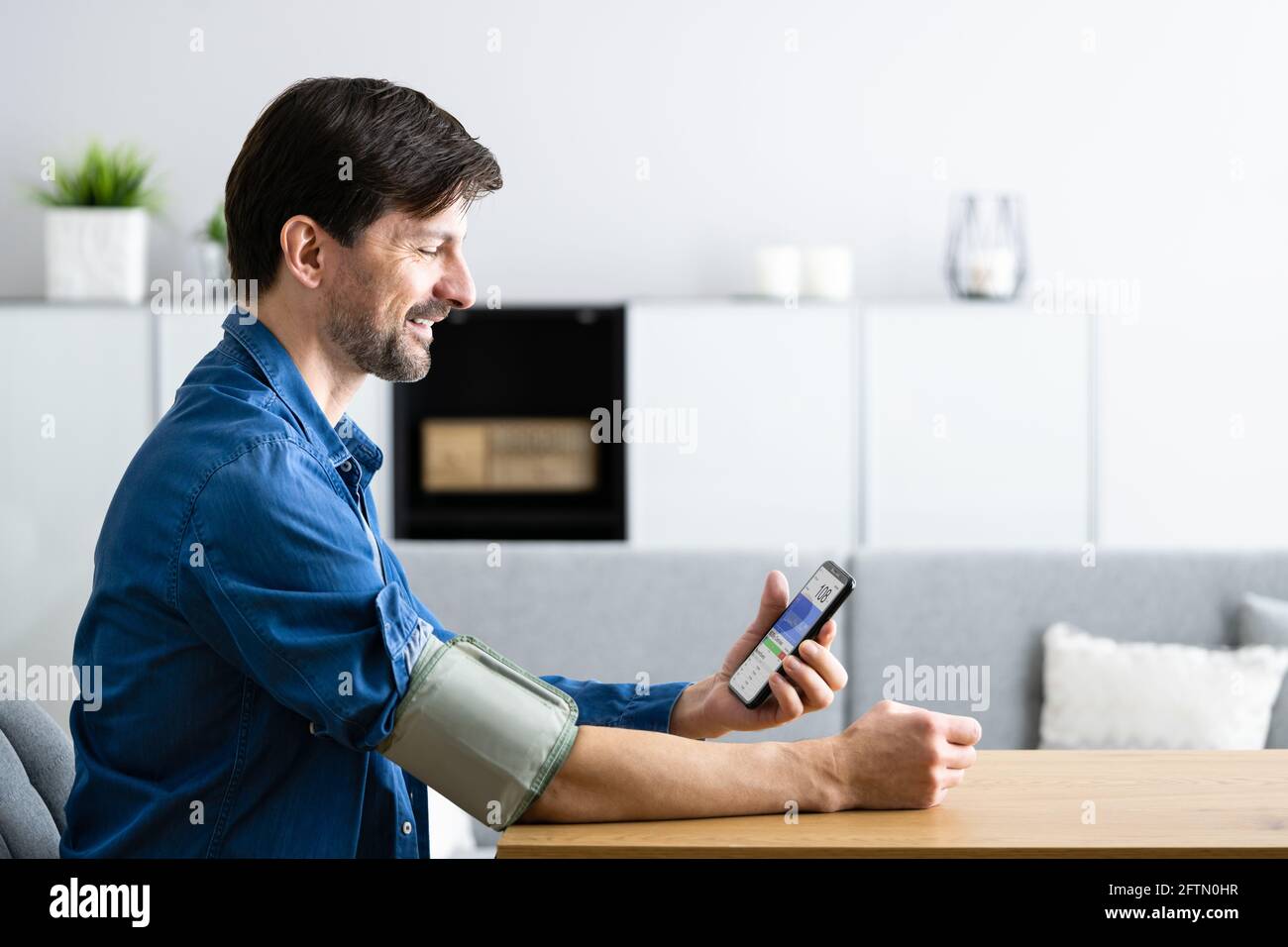 Blood Pressure Check Using Smart Monitor. African Patient Man Stock ...