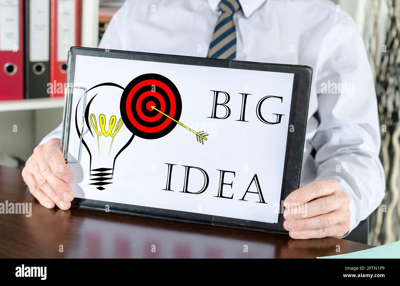 Big idea concept shown by a businessman Stock Photo - Alamy