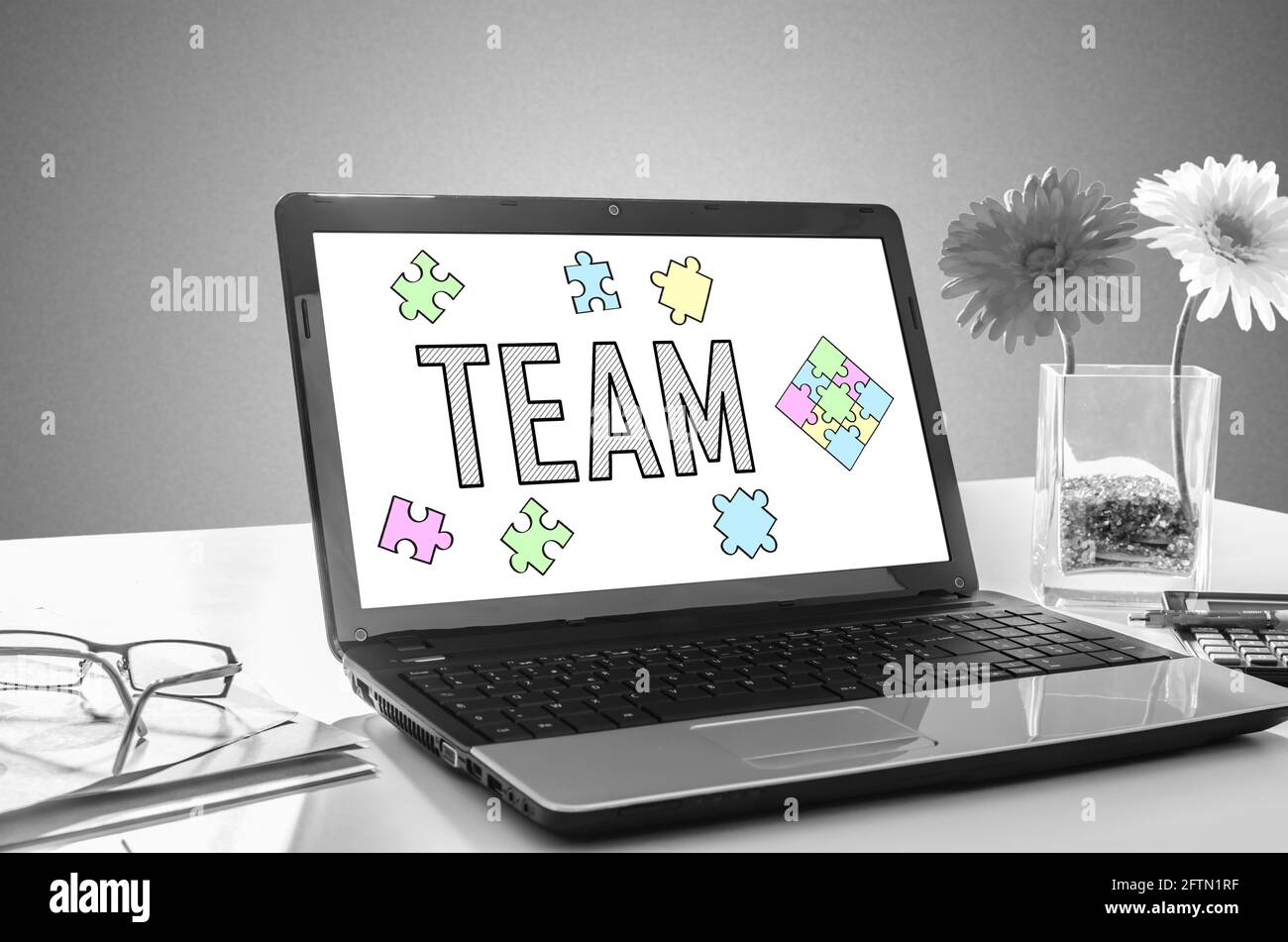 Laptop screen showing team concept Stock Photo - Alamy