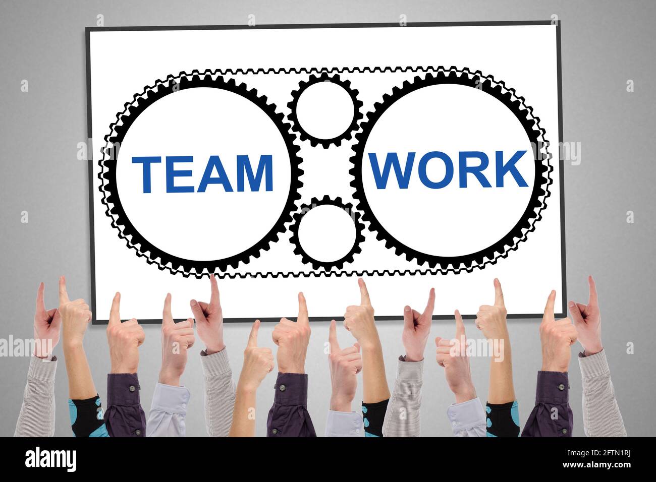 Teamwork concept on a whiteboard pointed by several fingers Stock Photo ...