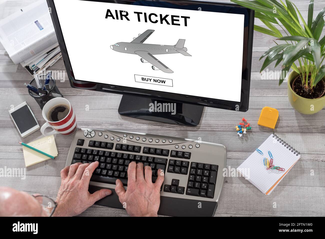 Man using a computer with air ticket booking concept on the screen ...