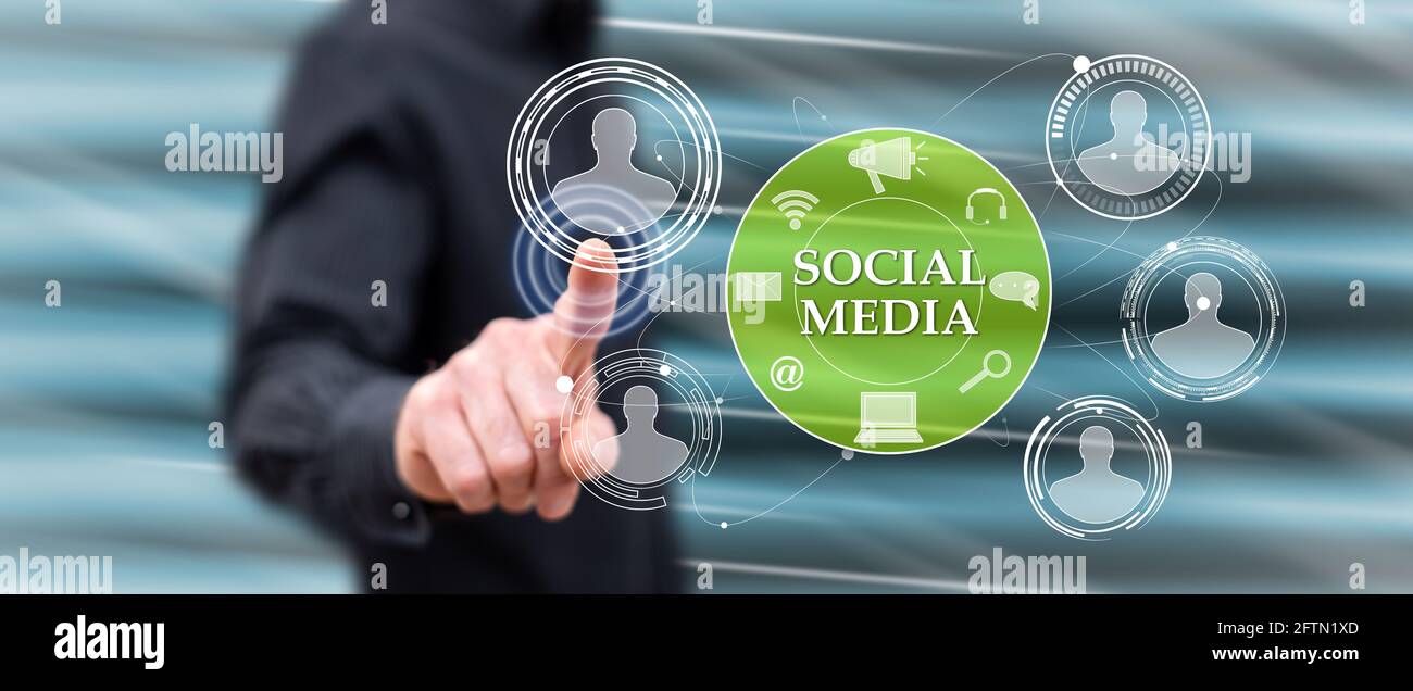 Man touching a social media concept on a touch screen with his finger ...