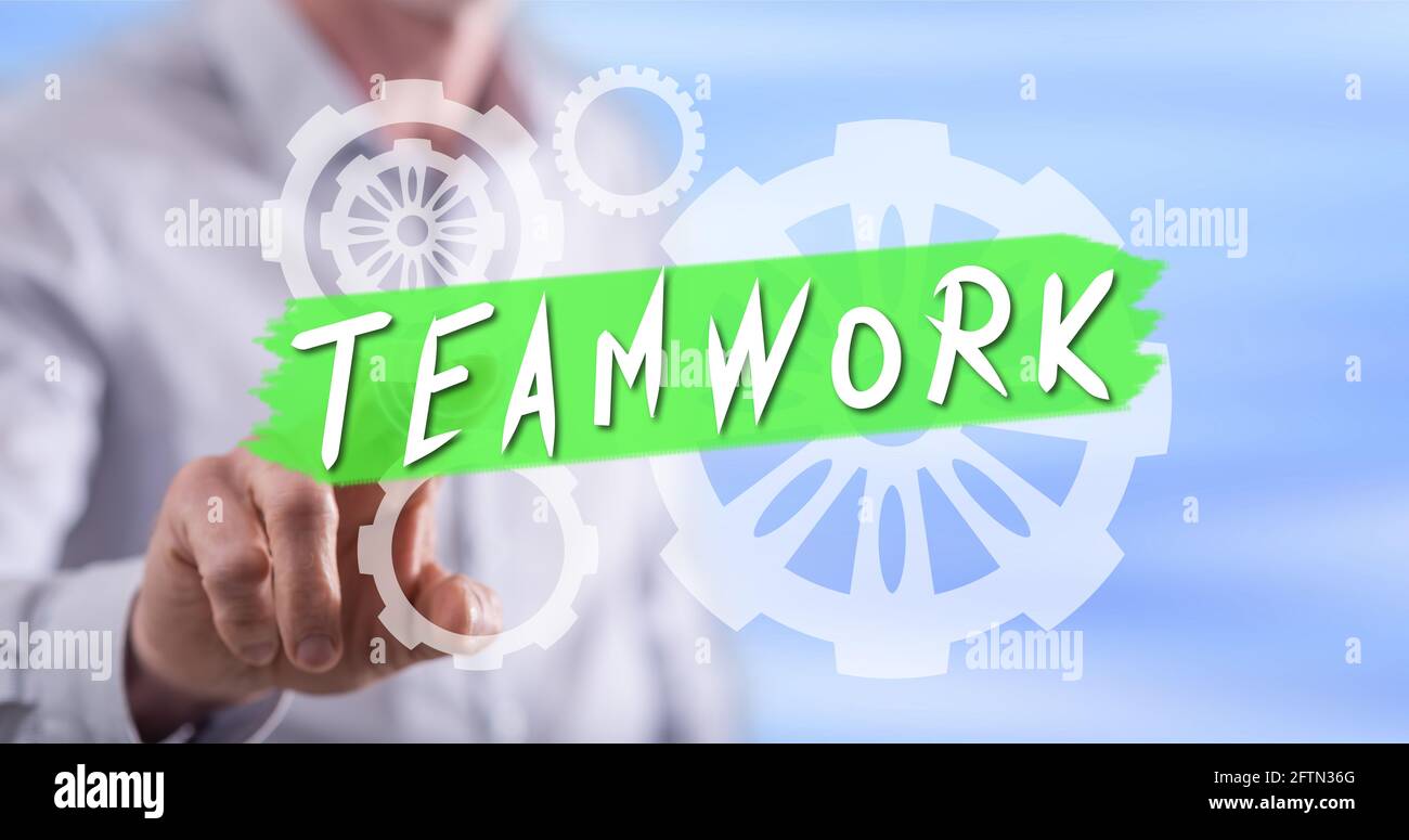 Man touching a teamwork concept on a touch screen with his finger Stock ...