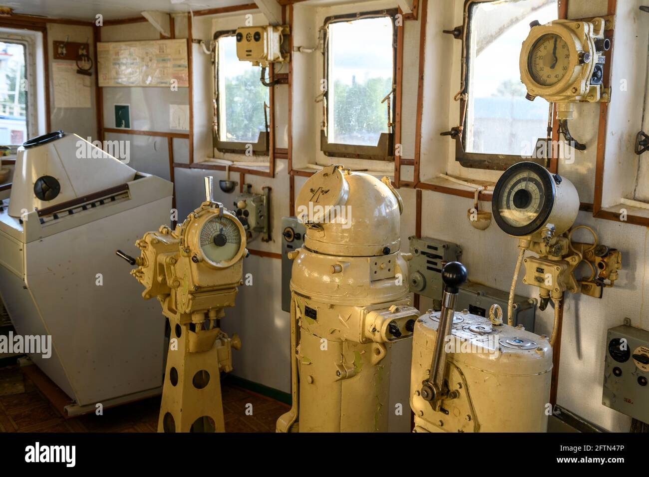 Navigational bridge on abandoned vessel. Old derelict ship wheelhouse ...
