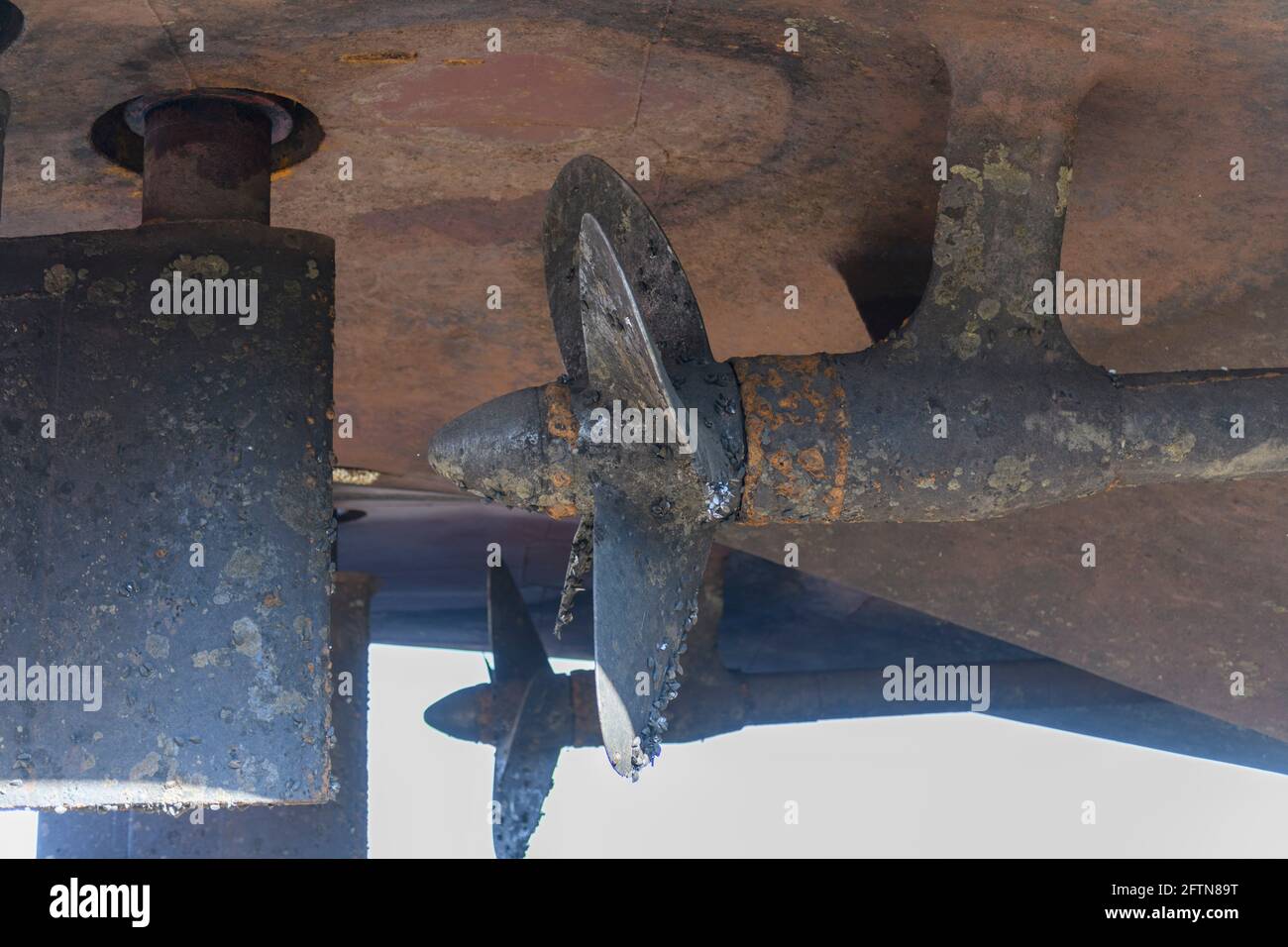 Fixed blade propeller and rudder with shells. Cargo vessel ashore on ...