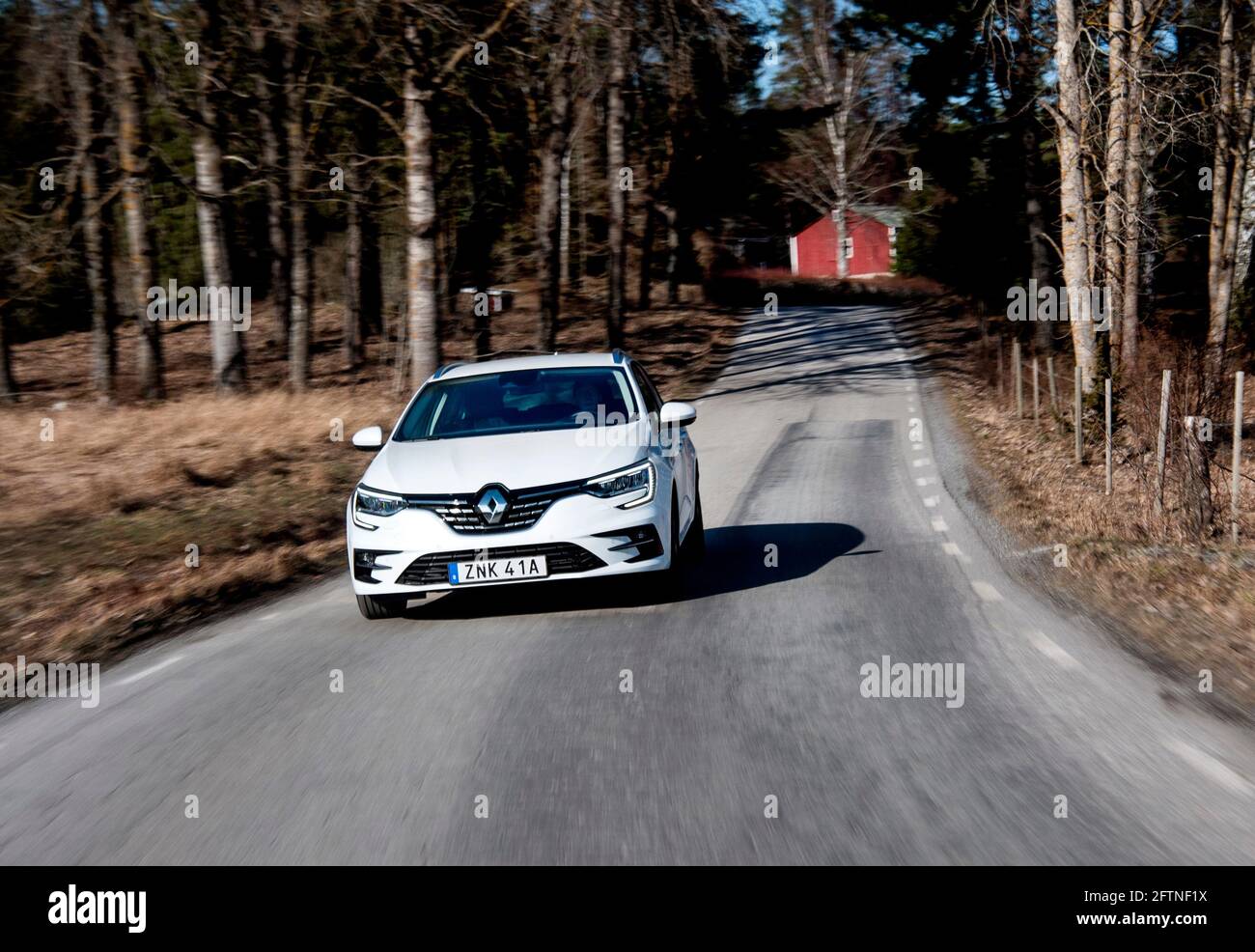 Renault Mégane Sports Tourer E-Tech. A car driving on a road Photo ...