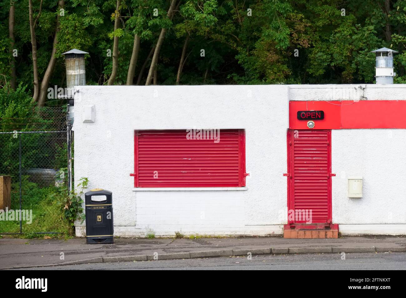 Shop front with blank sign and closed shutter door Stock Photo - Alamy
