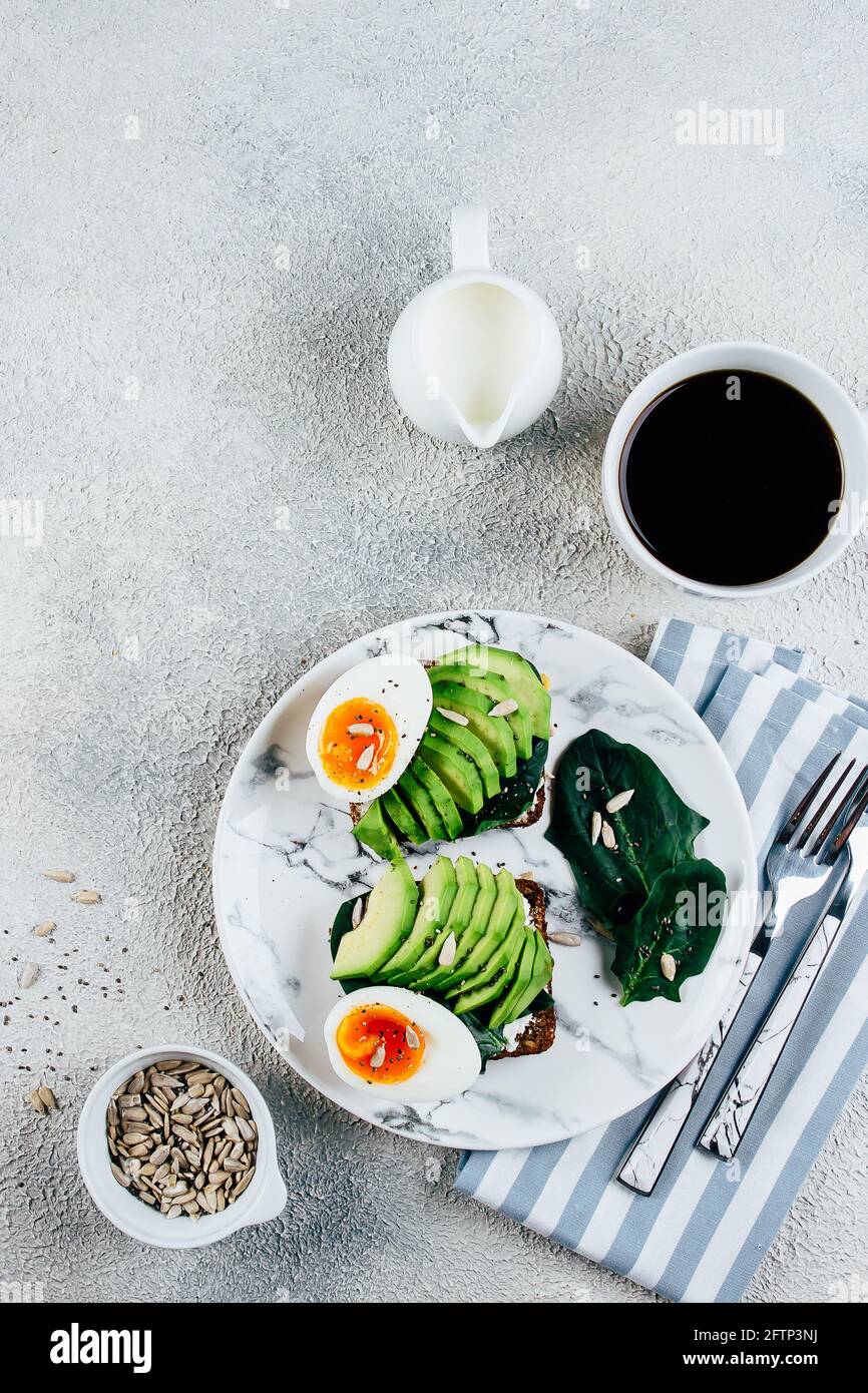 Avocado sandwich on dark rye toast bread made with fresh sliced avocado ...