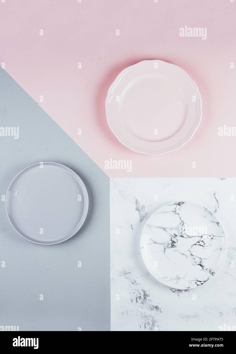 Gray, pink and marble plates on tricolor background. Beautiful light ...