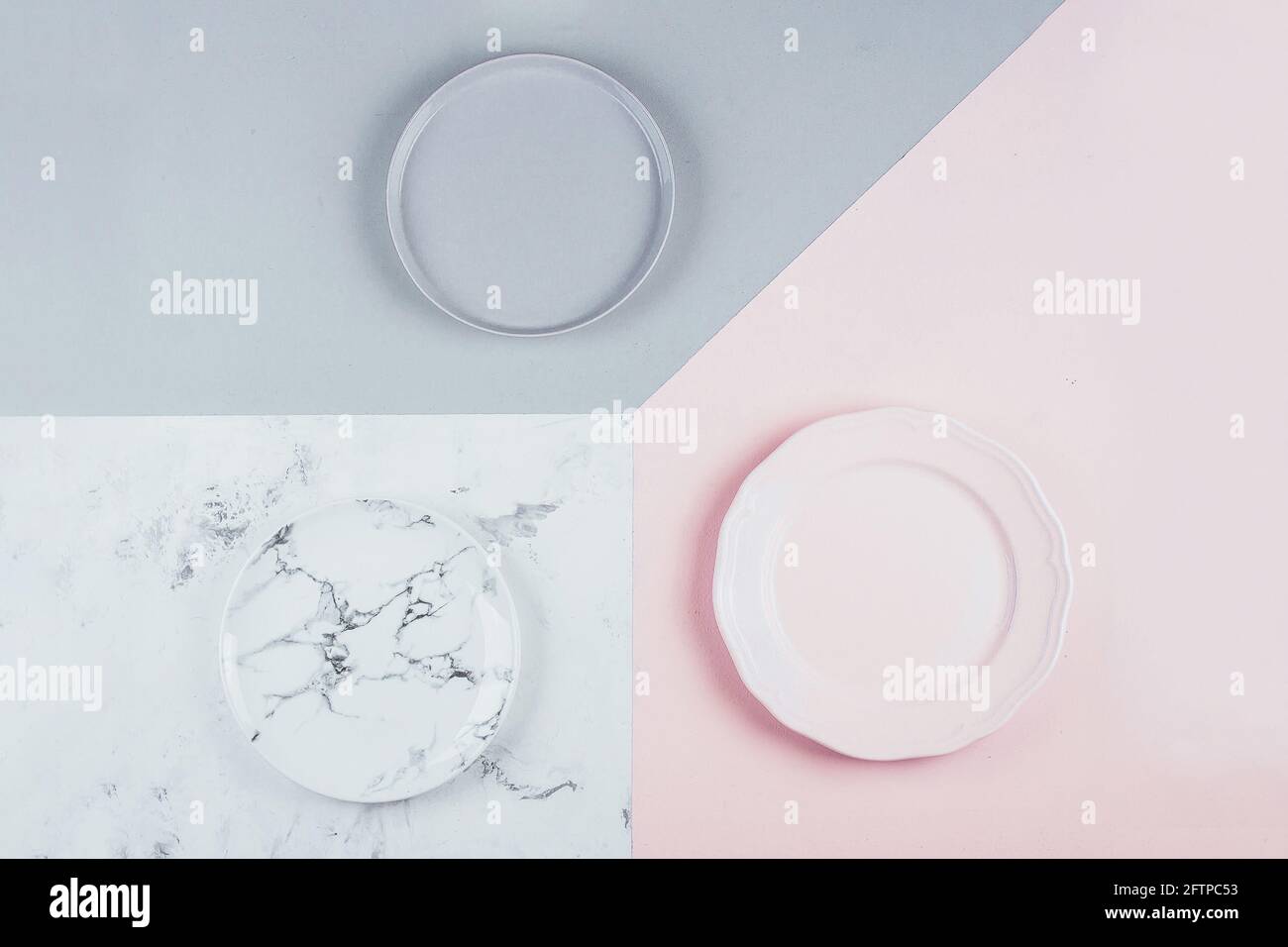 Gray, pink and marble plates on tricolor background. Beautiful light ...