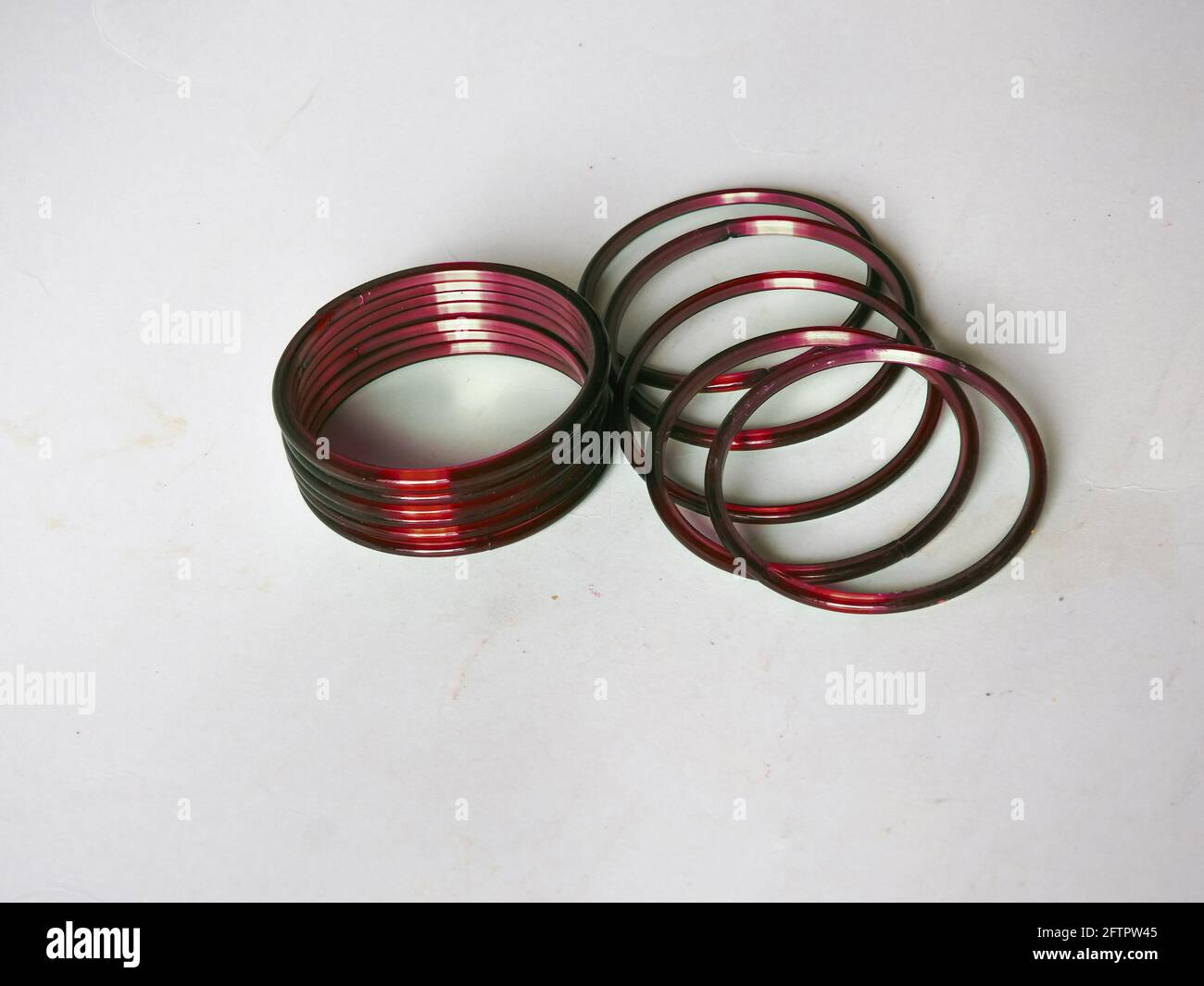 Group of traditional red glass bangles isolated on white background ...
